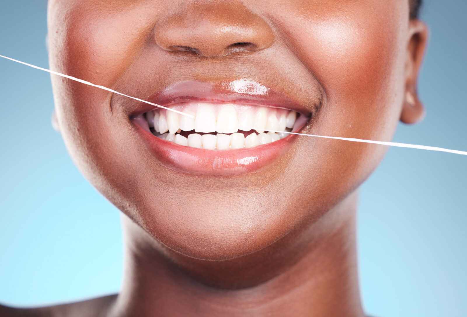Does Flossing Create Gaps in Teeth? - Lane & Associates